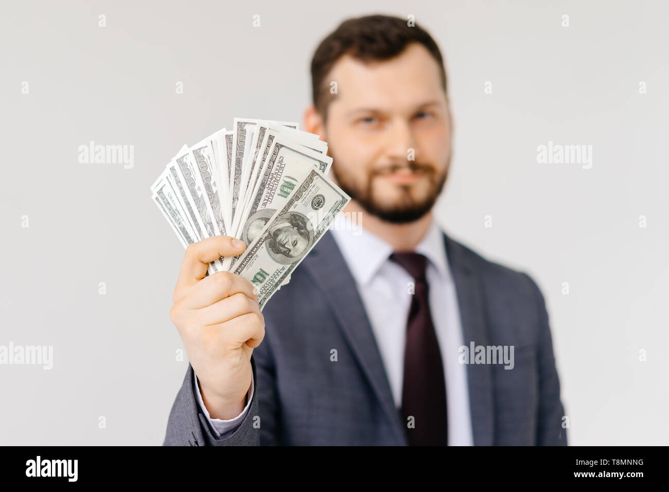 Male arm count hundred dollar bills closeup Stock Photo - Alamy