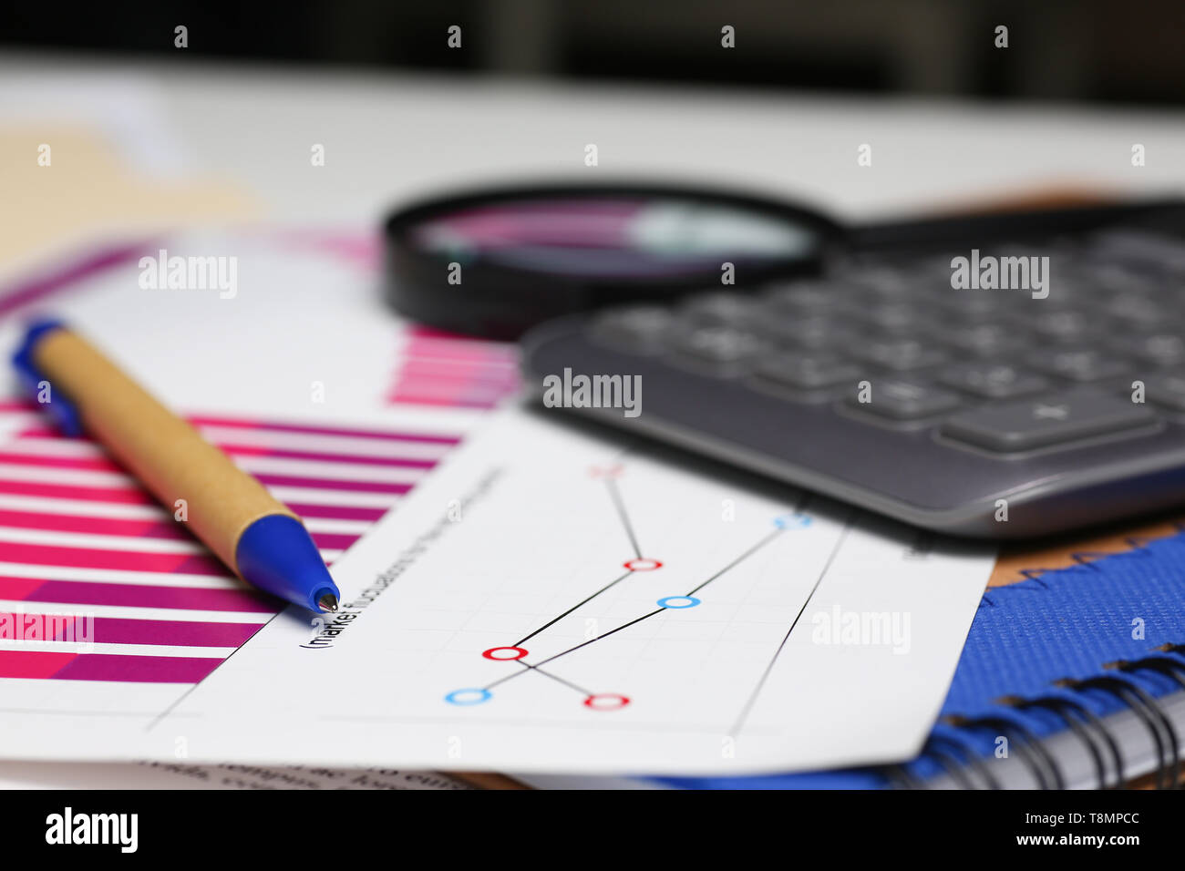 Silver calculator and financial statistics on clipboard Stock Photo - Alamy