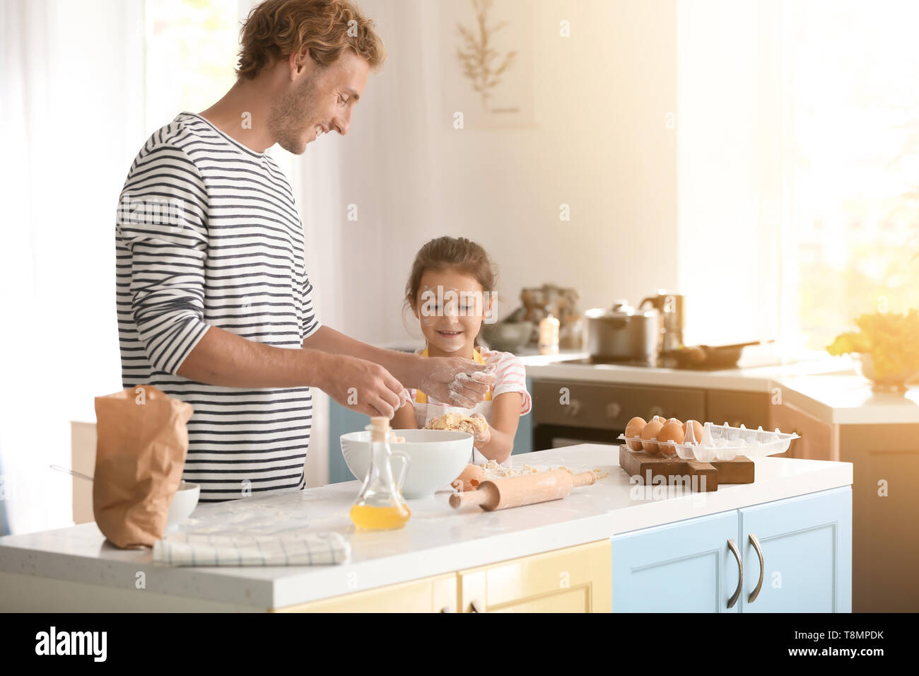 Father and daughter cooking together in kitchen Stock Photo - Alamy