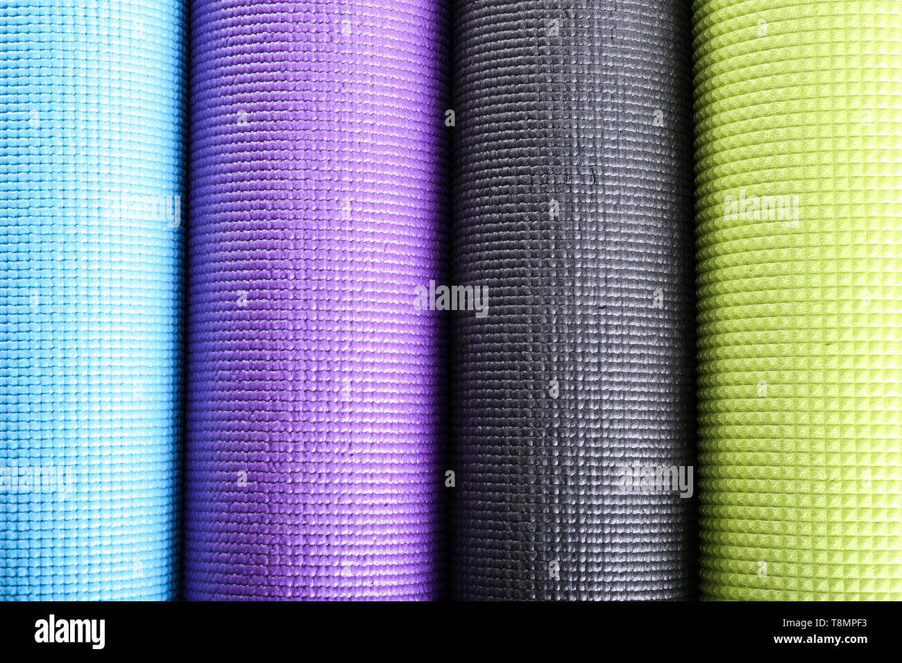 Different colorful yoga mats Stock Photo - Alamy