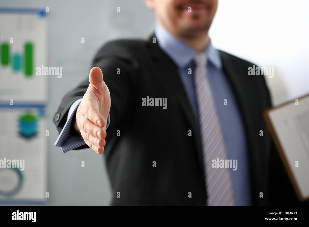 Man in suit and tie give hand as hello Stock Photo - Alamy