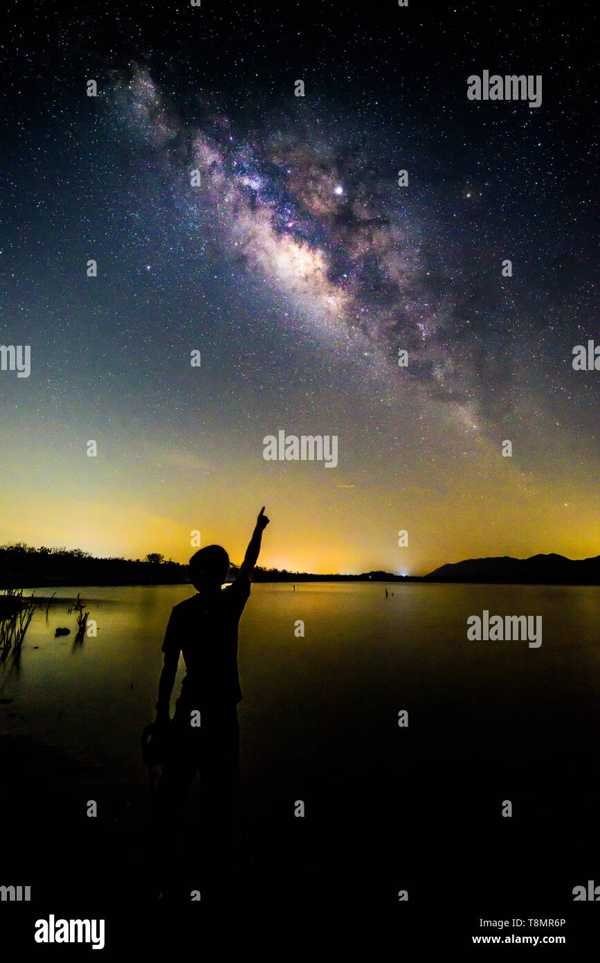 The man standing with milky way / The man point to the milky way Stock ...