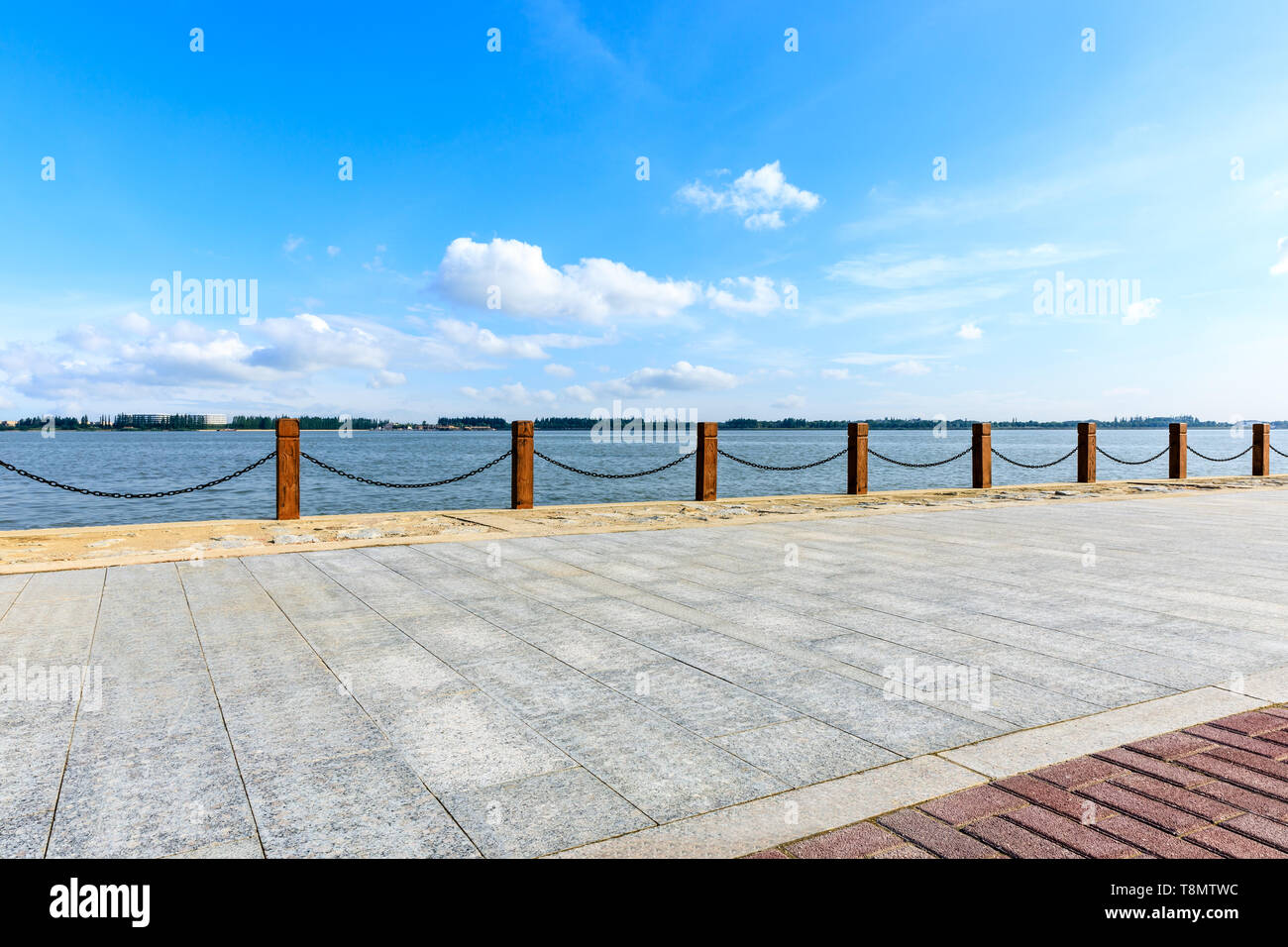 Beautiful lake and walkway with blue sky Stock Photo - Alamy