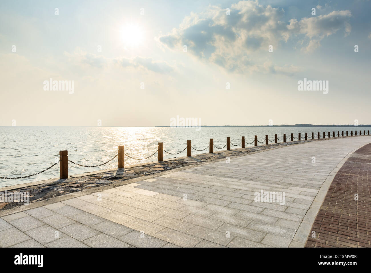 Beautiful lake and walkway with blue sky Stock Photo - Alamy