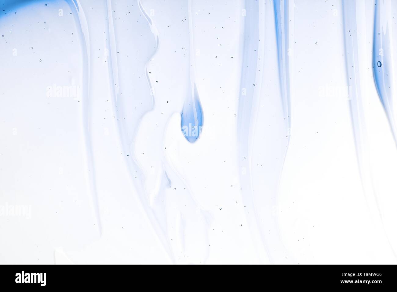 Transparent light blue smear of face cream isolated on white background ...