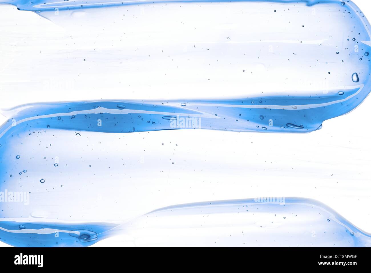 Transparent light blue smear of face cream isolated on white background ...