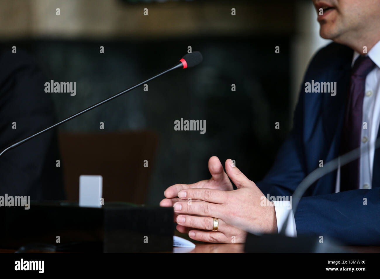 Details with the hands of a man in a suit (businessman, CEO, politician ...