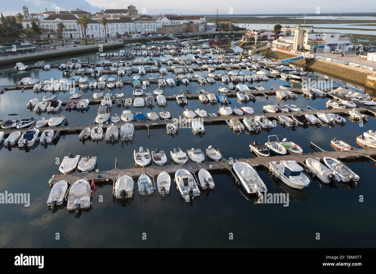Boats at moorings early morning in the marina at the harbour at Faro ...