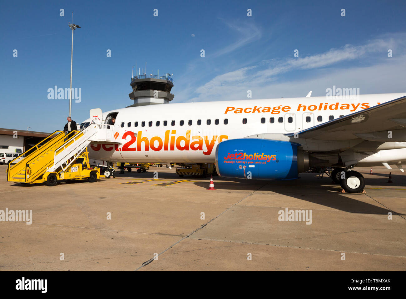 Jet2 package holiday plane passengers disembarking at the airport Faro ...