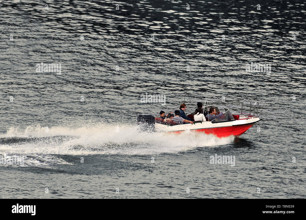 moving red motorboat Stock Photo - Alamy