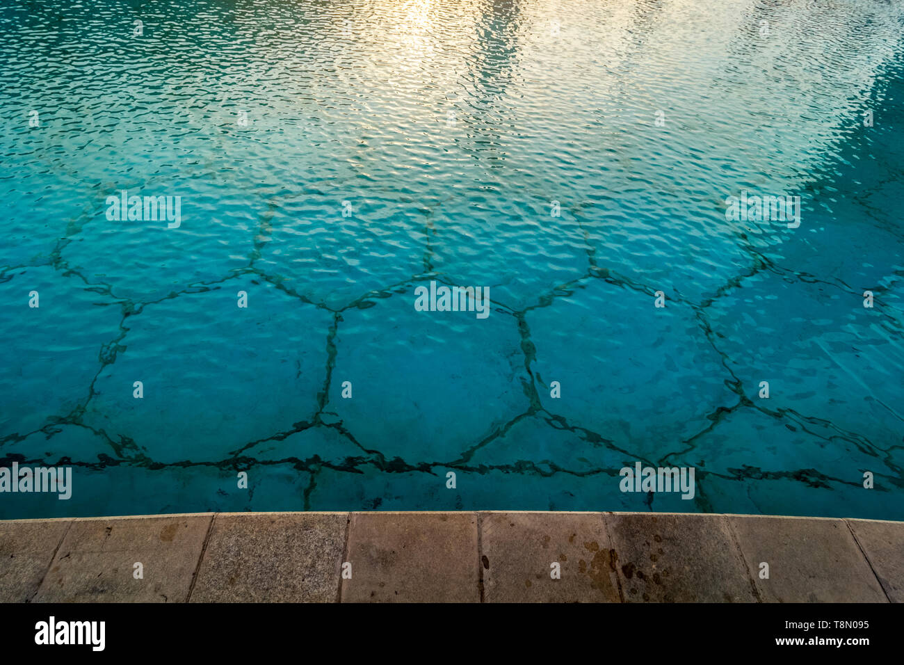 Pure turquoise water in the pool with fountains Stock Photo - Alamy