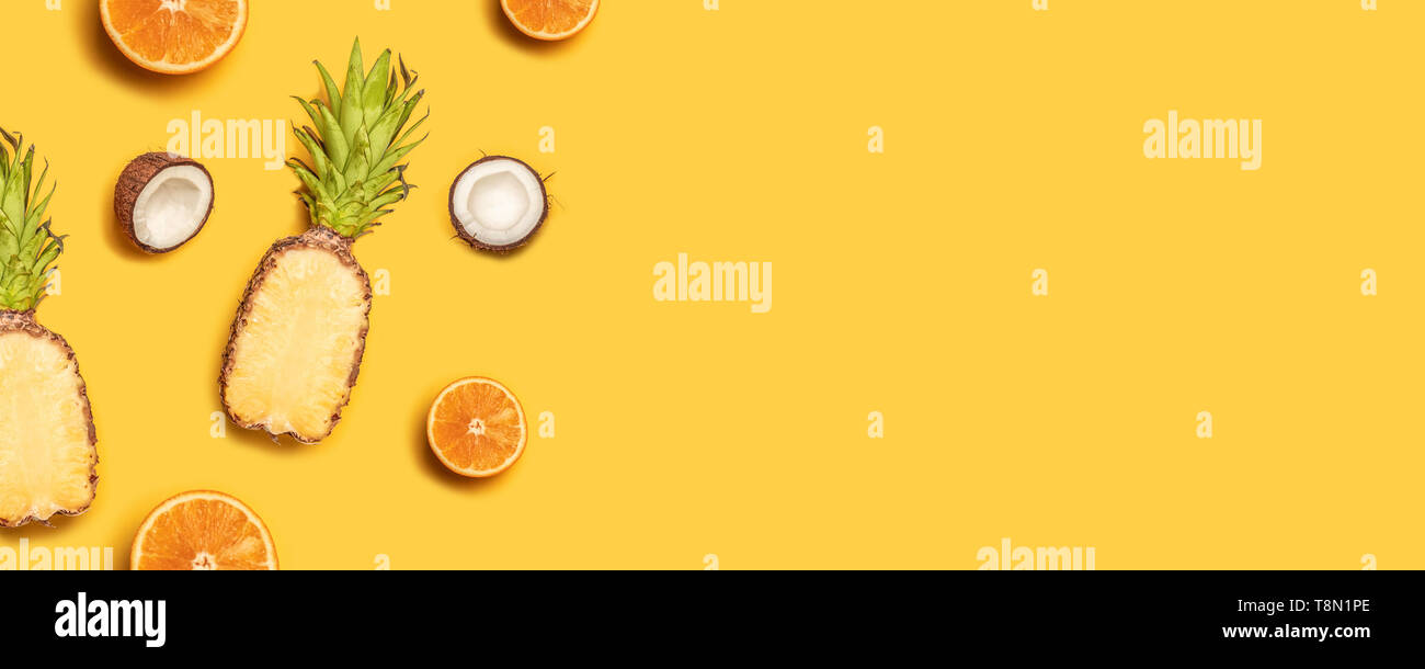Tropical abstract background. Pineapple, lemons, oranges and coconuts ...
