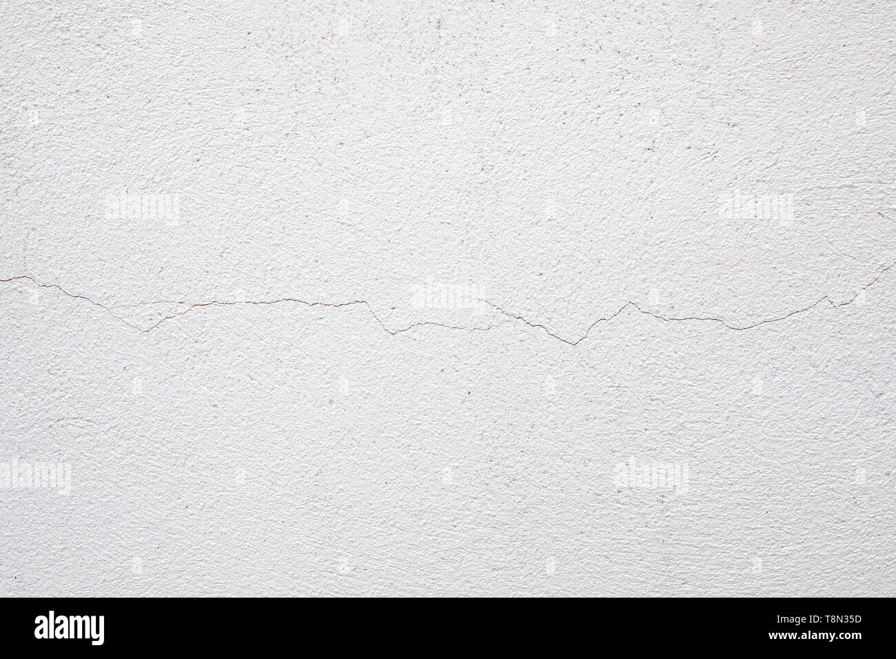Crack in a white wall with cement brick surface Stock Photo - Alamy