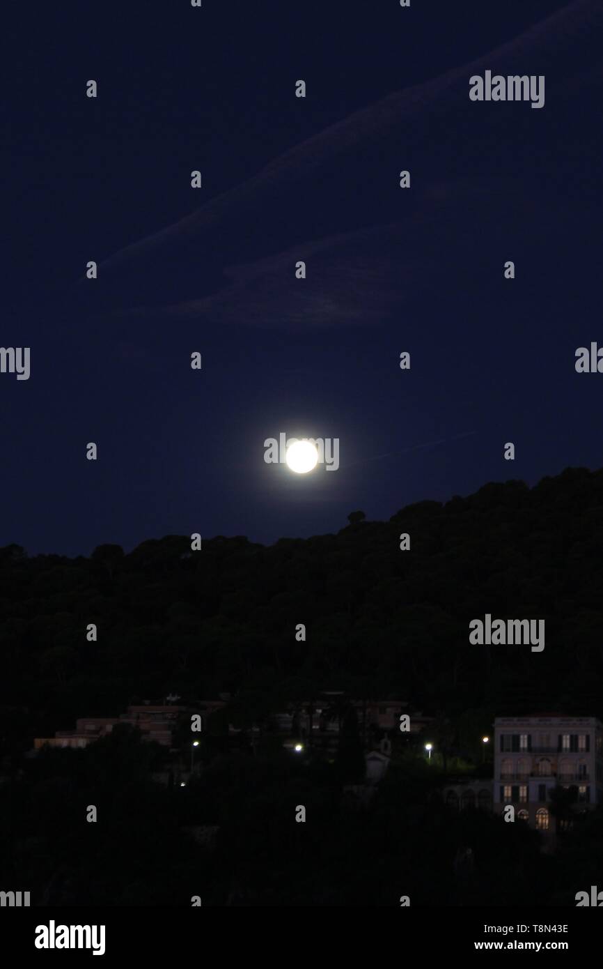 The moon setting at dawn over the French Riviera Stock Photo - Alamy
