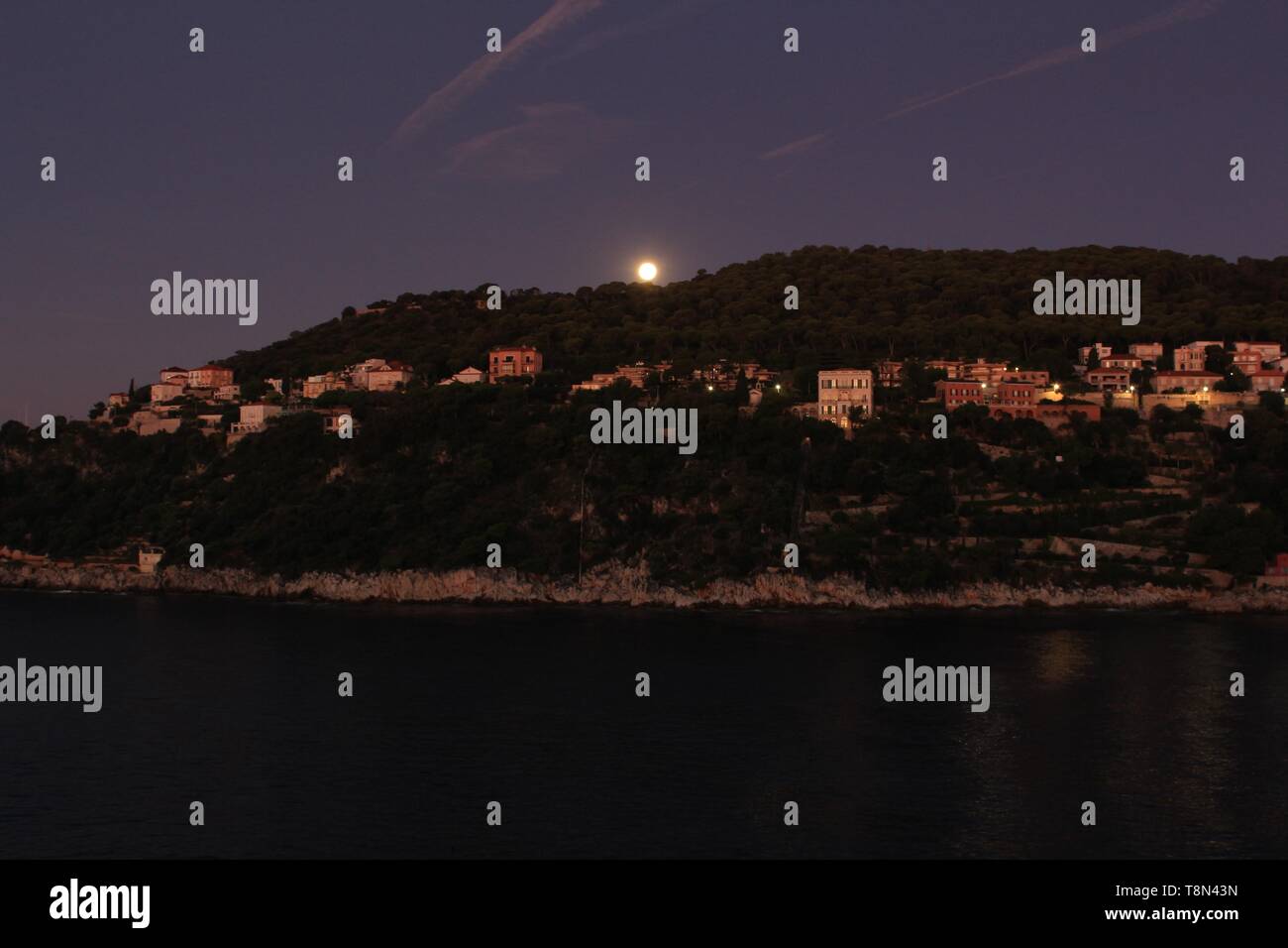 The moon setting at dawn over the French Riviera Stock Photo - Alamy