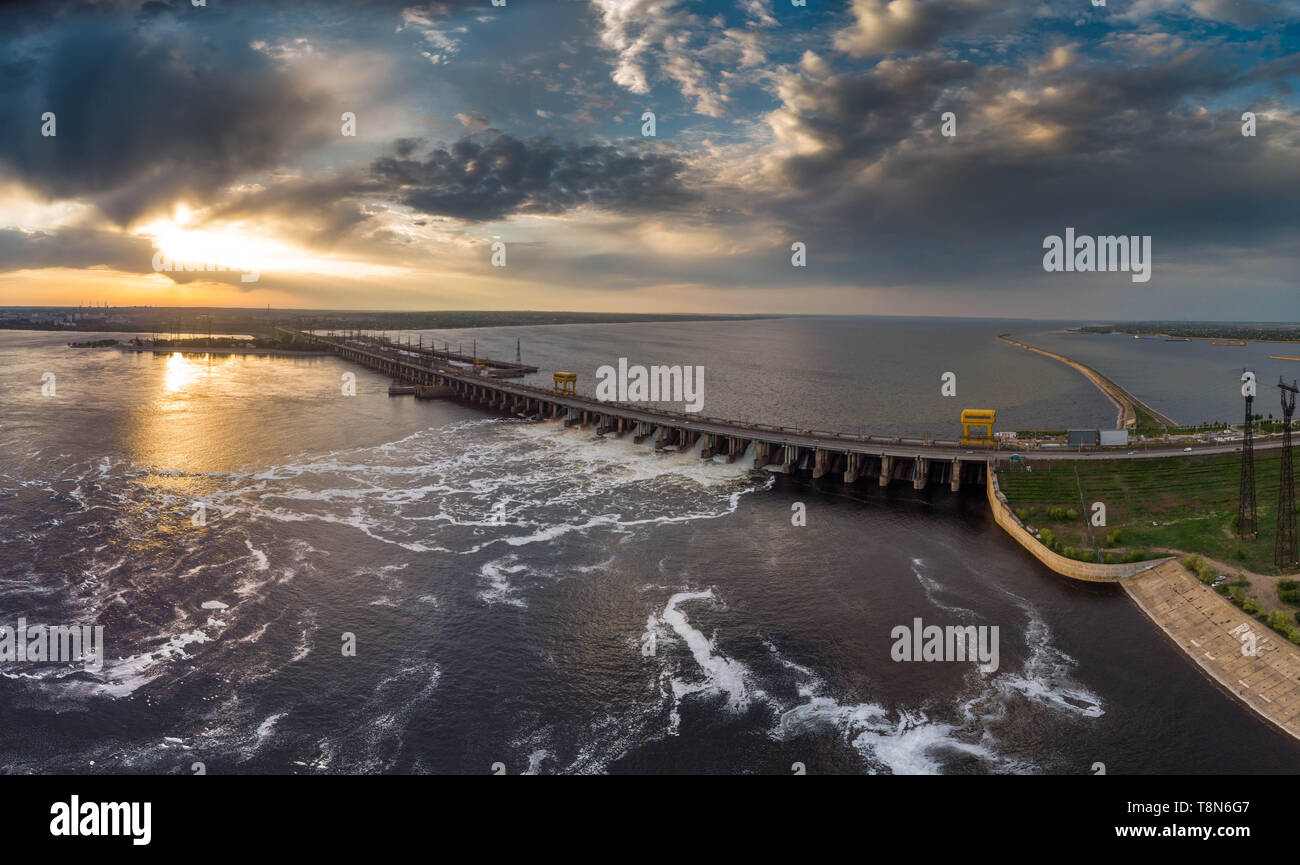 Powerful stream of water falls from the shutter in the dam ...