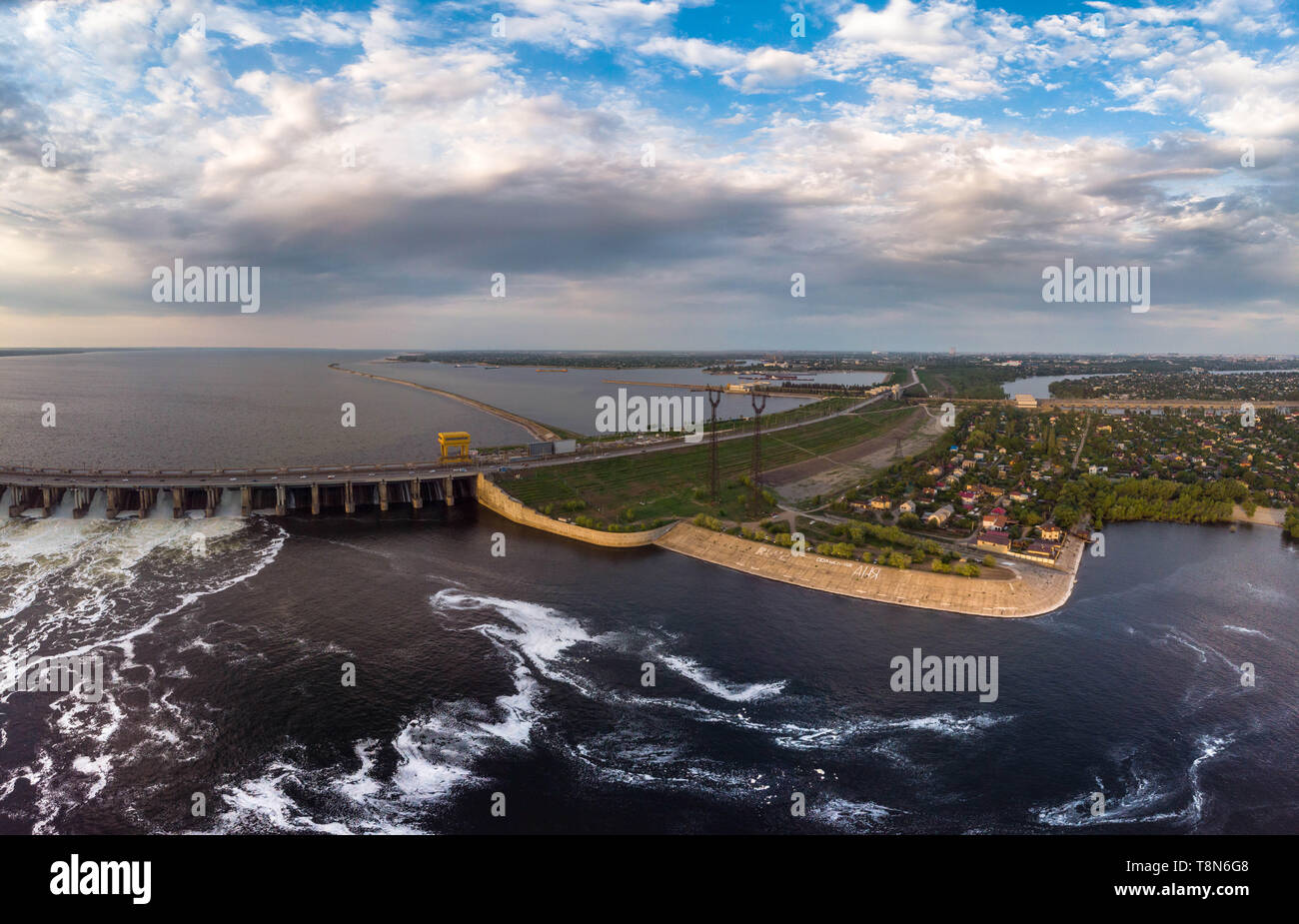 Powerful stream of water falls from the shutter in the dam ...