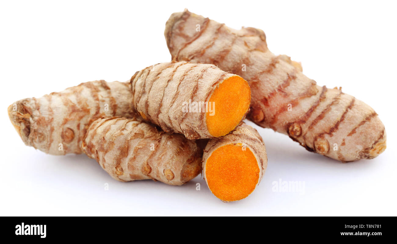 Raw turmeric over white background Stock Photo - Alamy