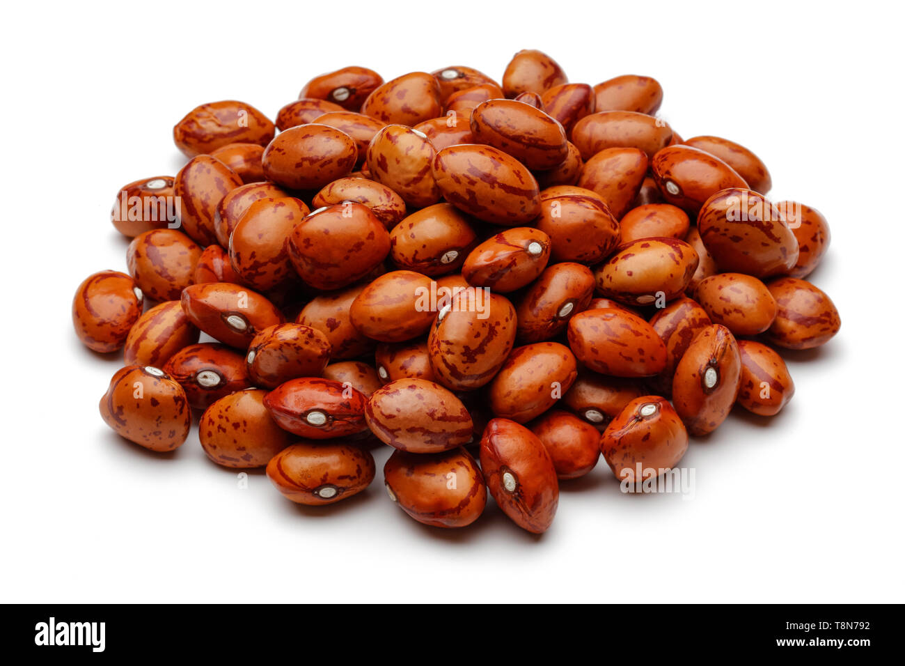 Heap of dried pinto beans isolated on white background Stock Photo - Alamy