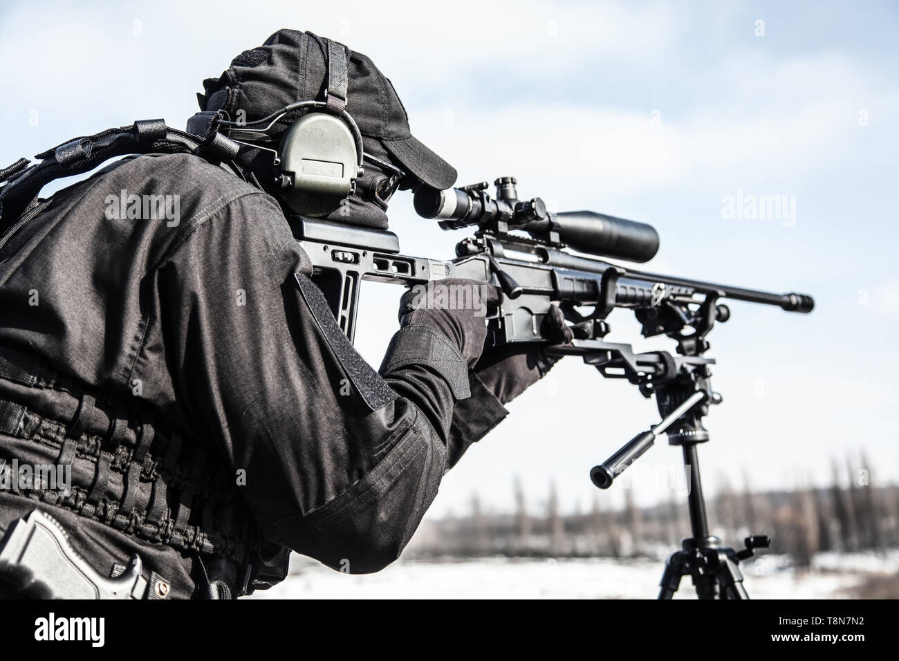 Equipped police SWAT sniper shooting with rifle Stock Photo - Alamy