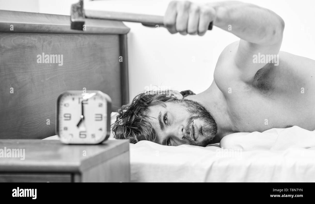 Annoying sound. Annoying ringing alarm clock. Man bearded annoyed ...