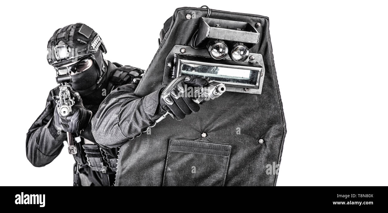 SWAT team behind ballistic shield studio shoot Stock Photo - Alamy