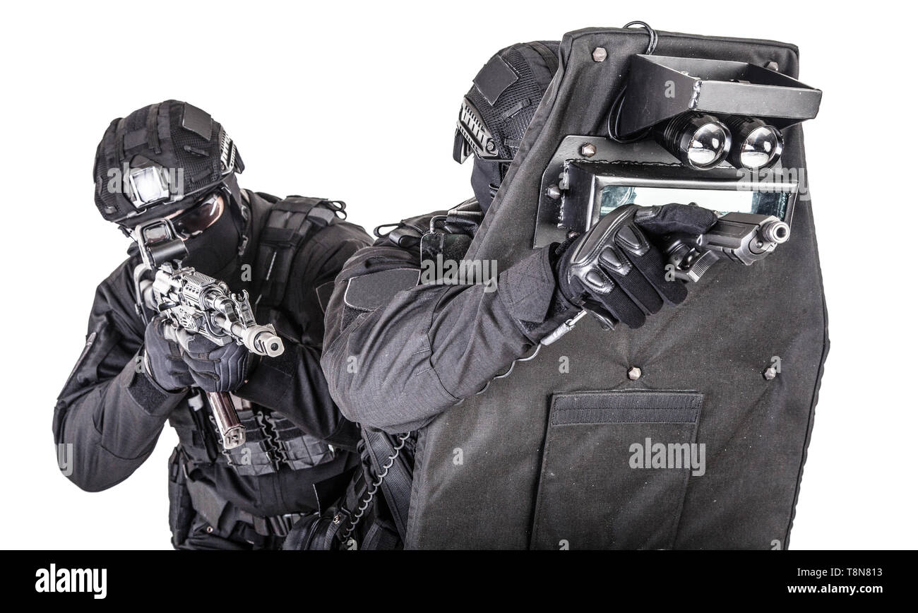 SWAT team behind ballistic shield studio shoot Stock Photo - Alamy