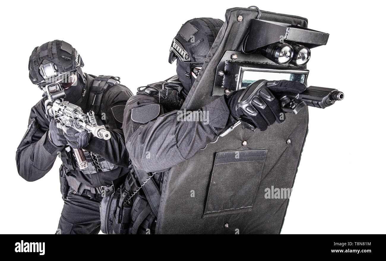 SWAT team behind ballistic shield studio shoot Stock Photo - Alamy