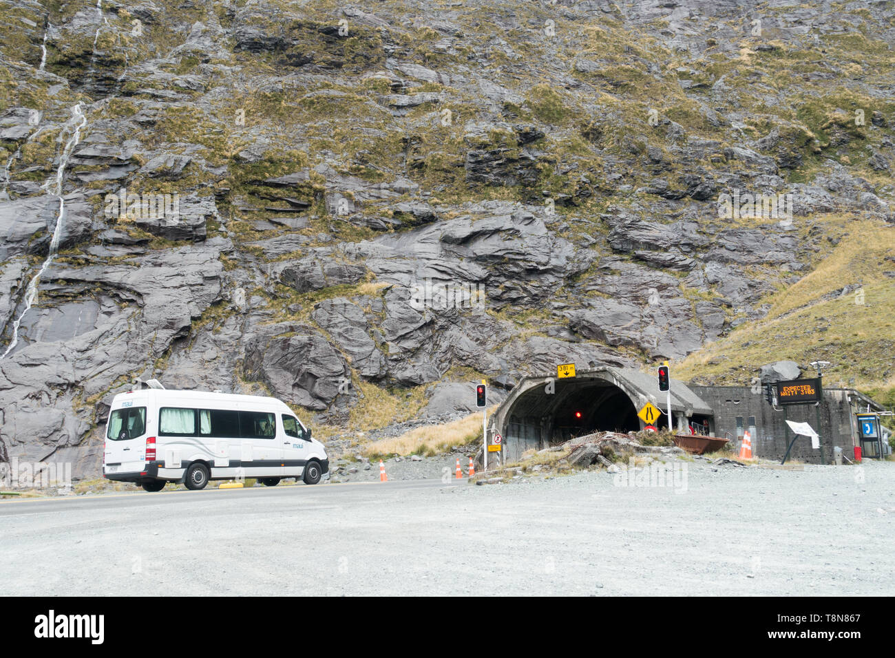 The entrance to the Homer Tunnel on the Milford Sound road. Kea parrots ...