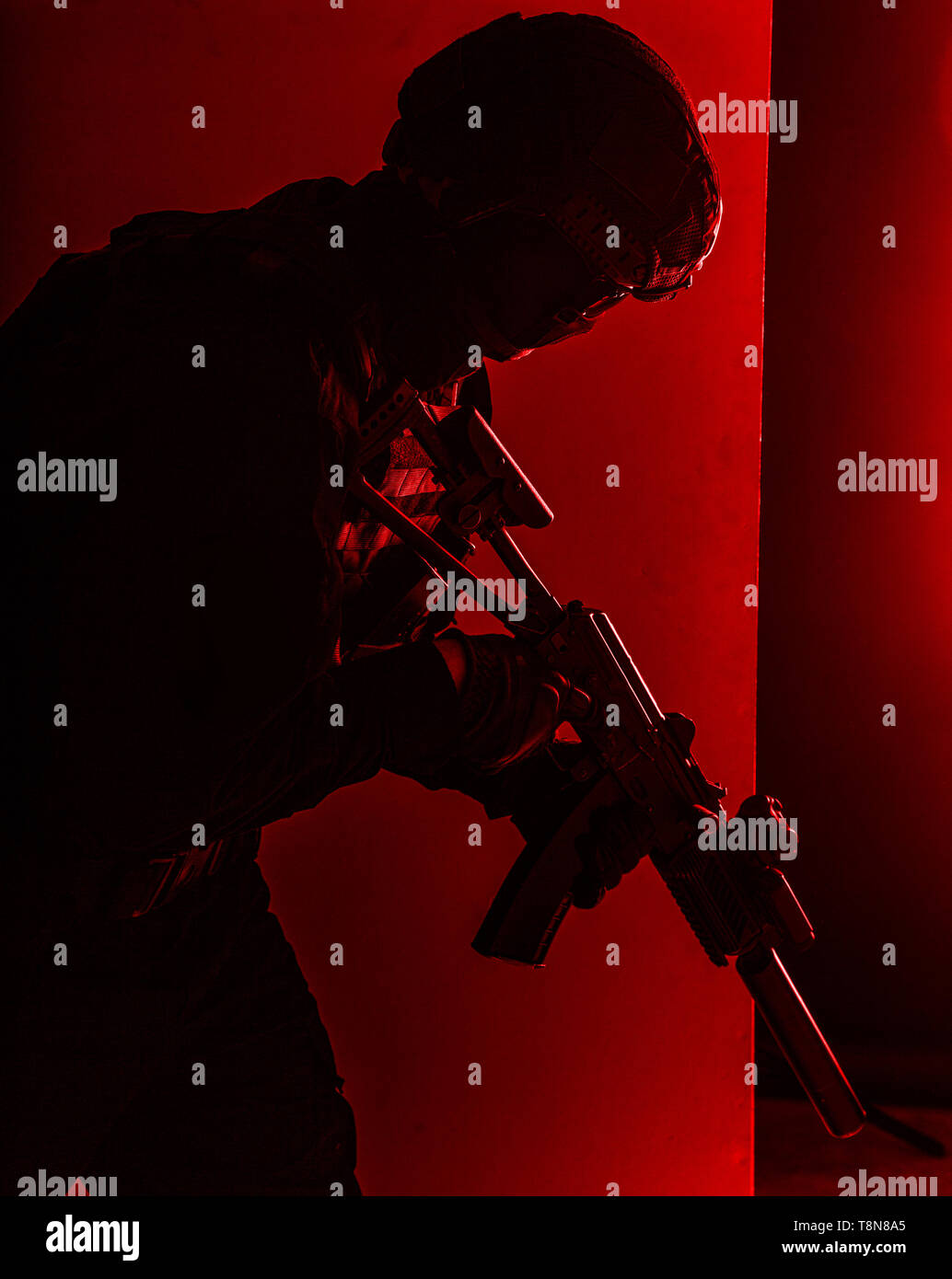 SWAT fighter with silenced assault rifle shoot Stock Photo - Alamy