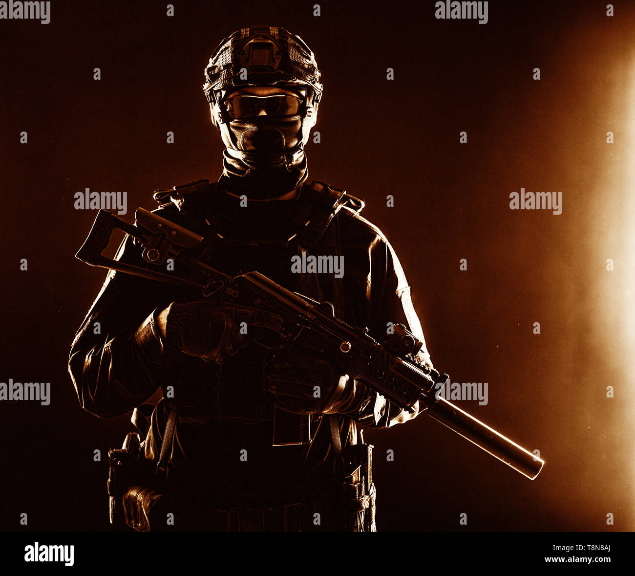 SWAT officer with service rifle low key portrait Stock Photo - Alamy