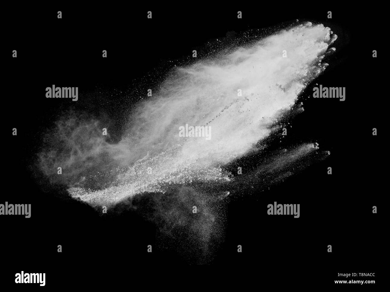 Freeze motion of white dust explosions isolated on black background ...