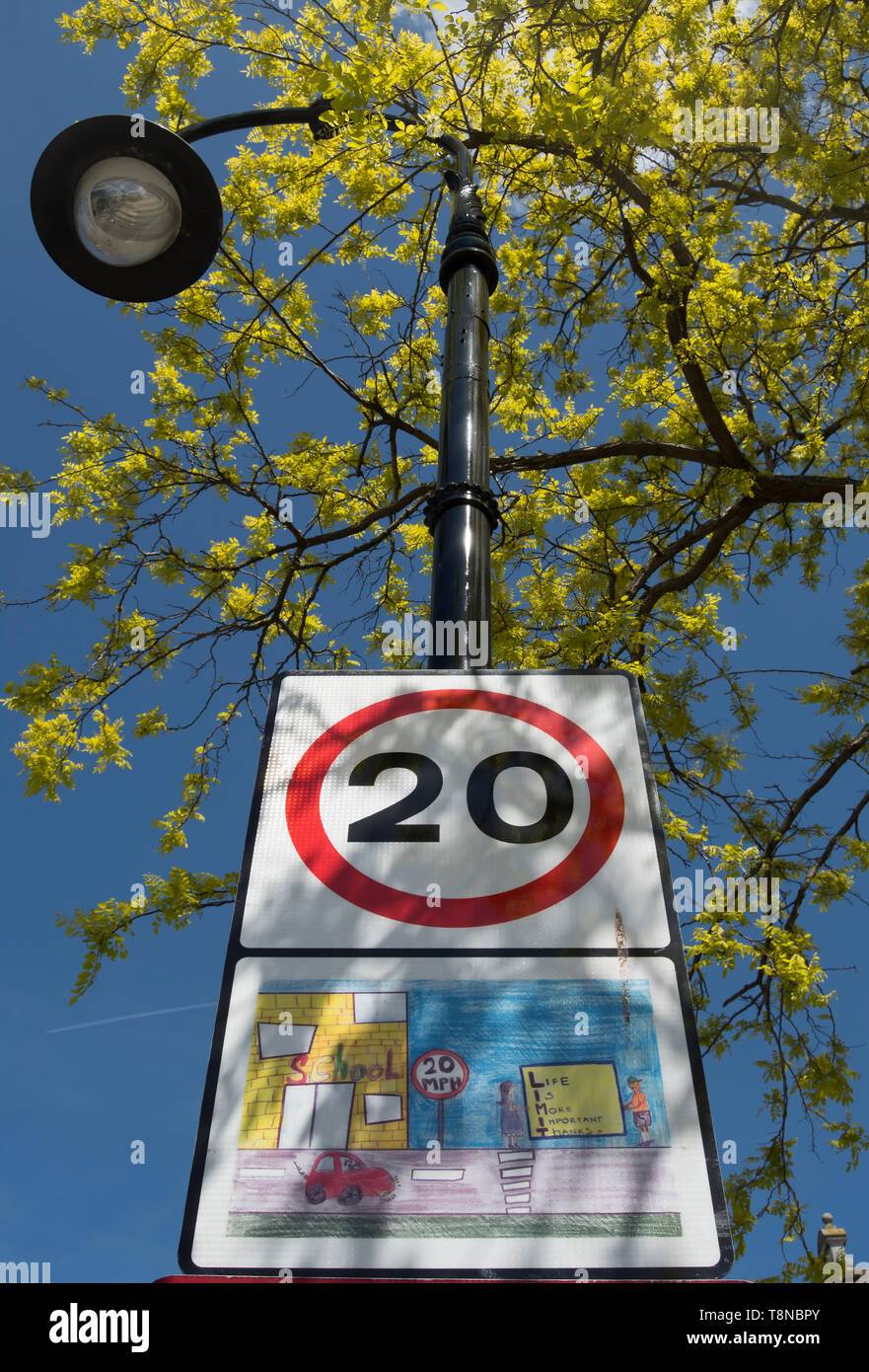 british 20mph speed limit sign with school childrens' drawing, in ...