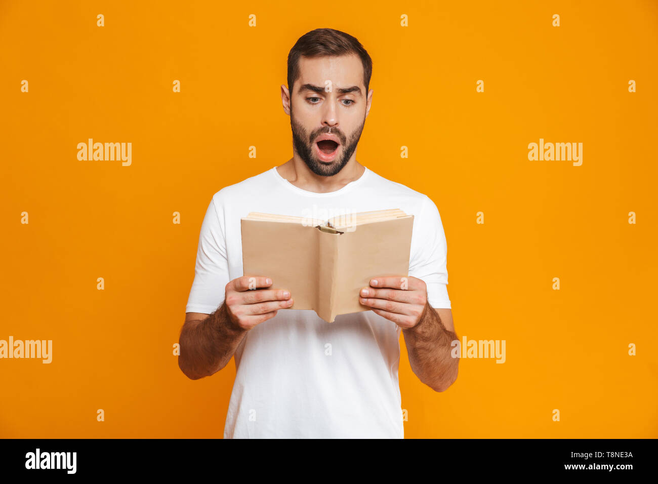 Surprised face guy reading book hi-res stock photography and images - Alamy
