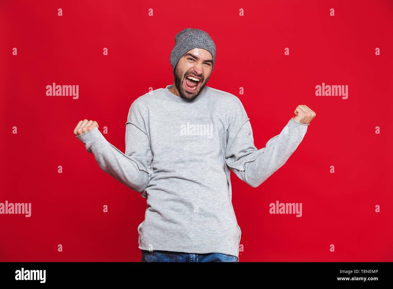 Image of positive man 30s with beard and mustache shouting and ...