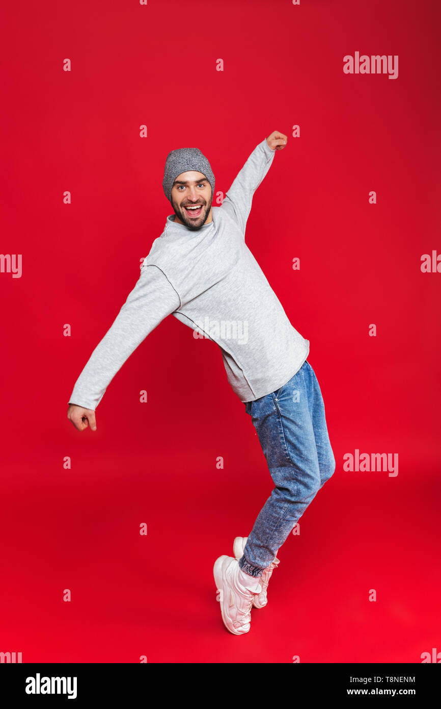 Full length image of happy man 30s with beard and mustache laughing ...