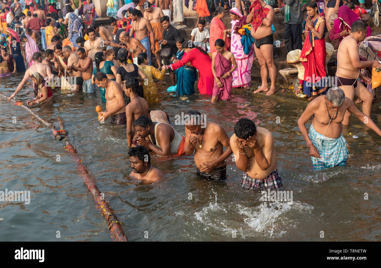 Hindu worshippers perform ritual bath and puja prayers in the River ...