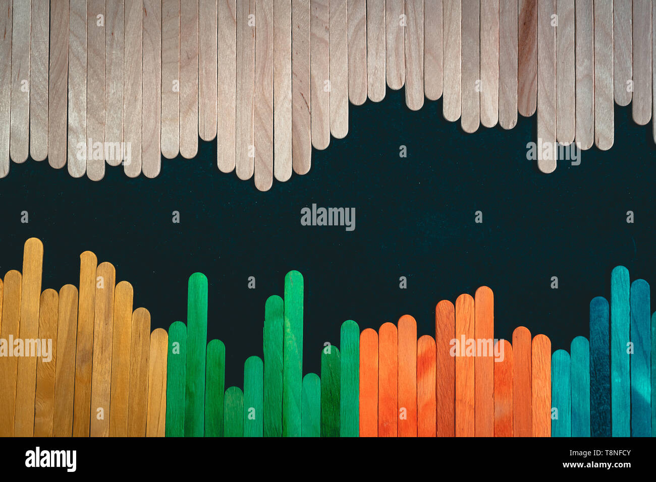 Colorful sticks isolated on black background Stock Photo - Alamy