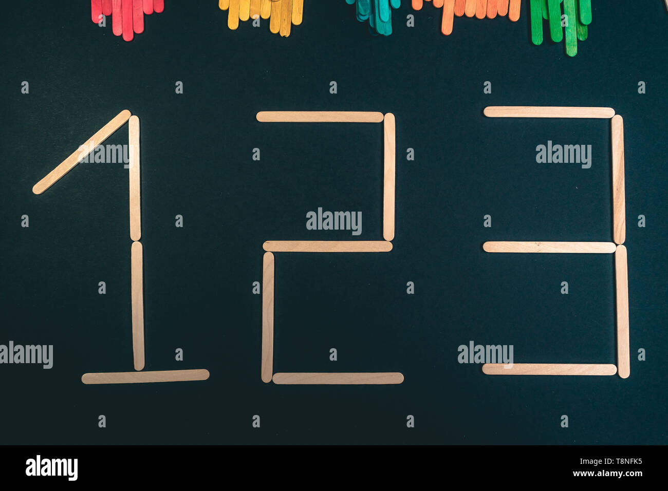 Numbers made of wood sticks isolated on black background Stock Photo ...