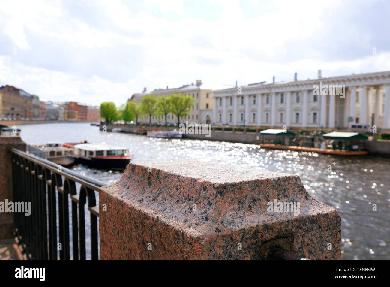 Granite embankment with cast iron bars. The river and the skyline Stock ...