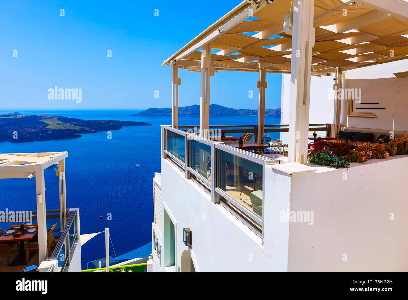 Santorini, Greece, veranda with sea view cafe, white houses, caldera ...