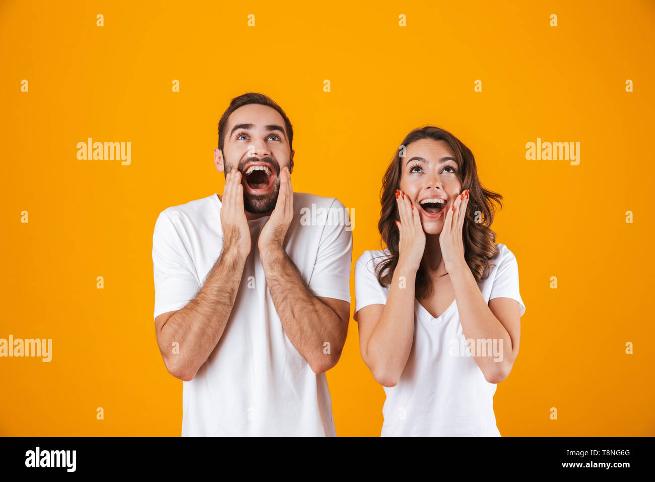 Image of happy people man and woman in basic clothing screaming in ...