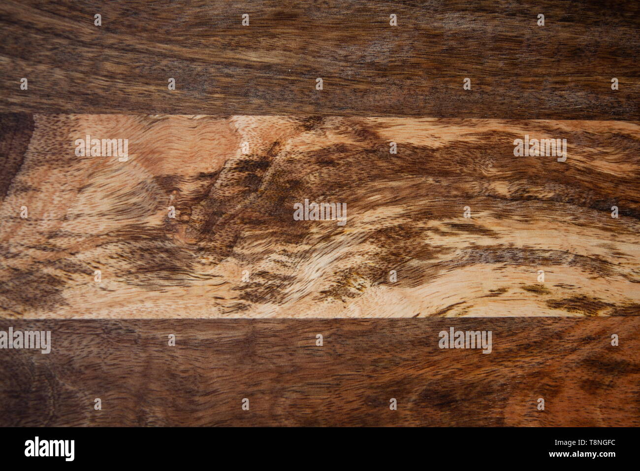 The contrasting pattern of wood on a wooden board from mango tree. The ...