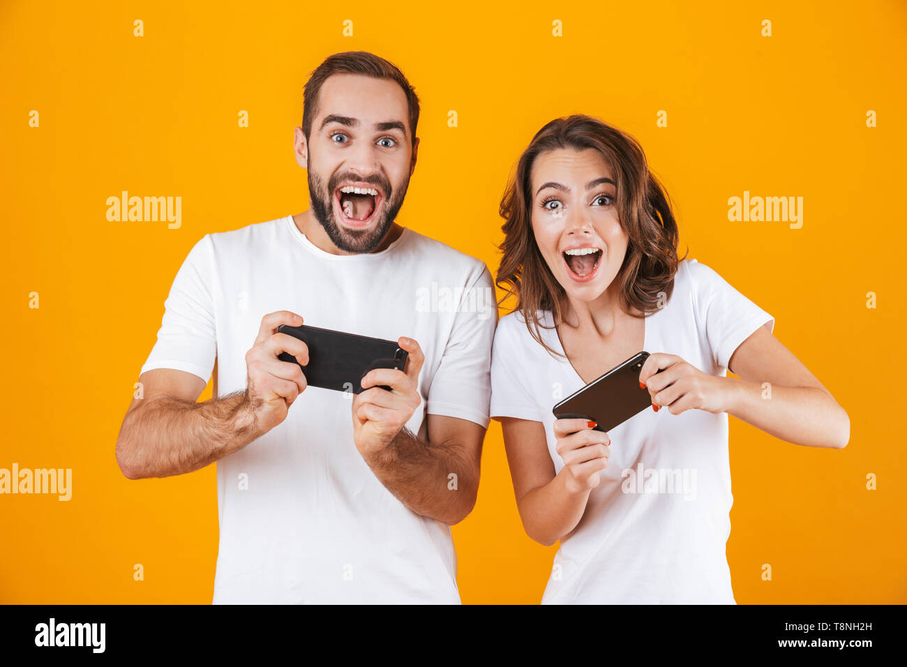 Image of beautiful man and woman playing together video games on ...