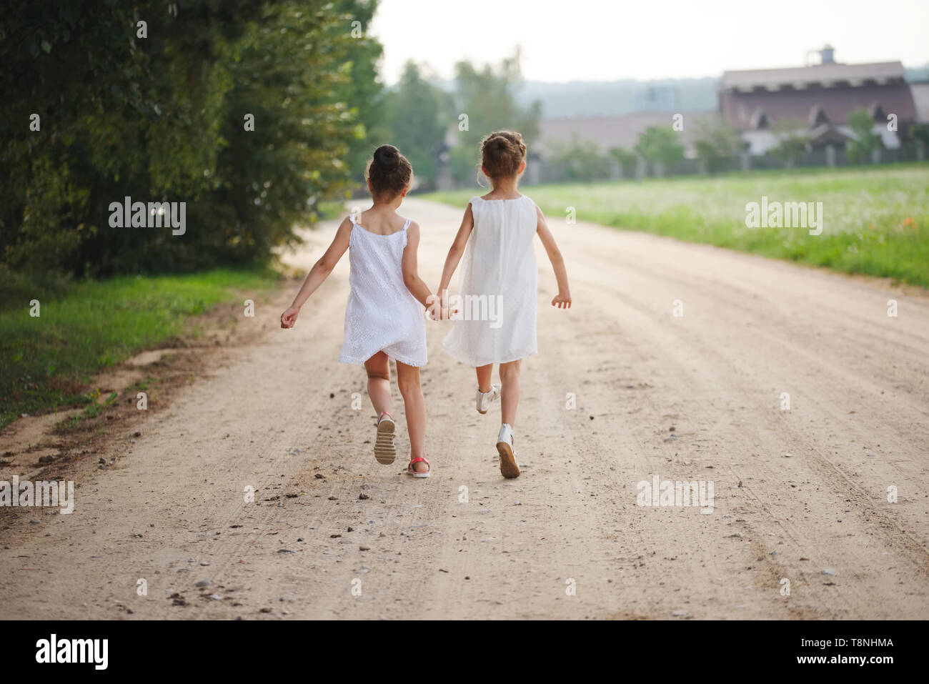 best happy friends playing in summer park Stock Photo - Alamy