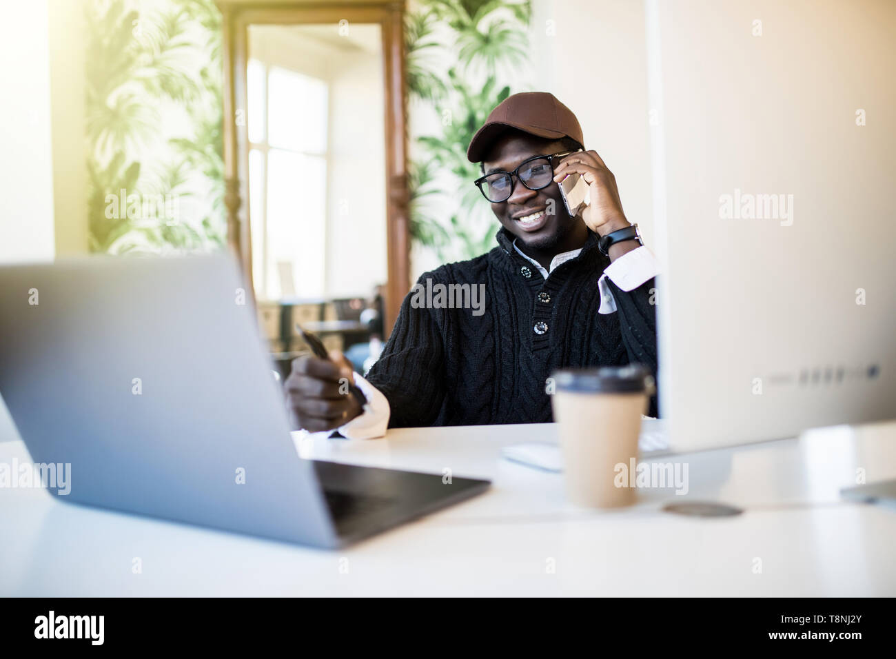 professional african black man talking on mobile cell phone to clients ...