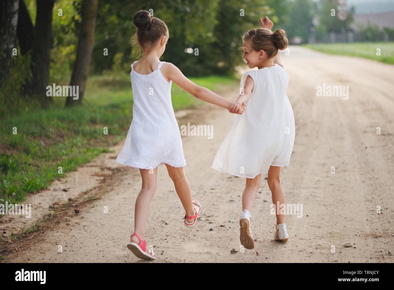 best happy friends playing in summer park Stock Photo - Alamy