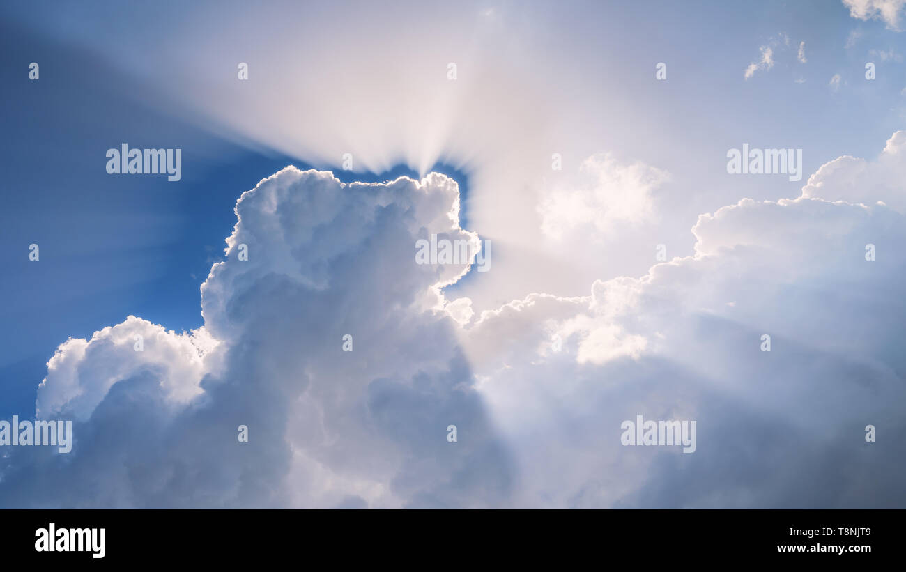 Sun shining through the heavenly beautiful clouds in the sky Stock ...
