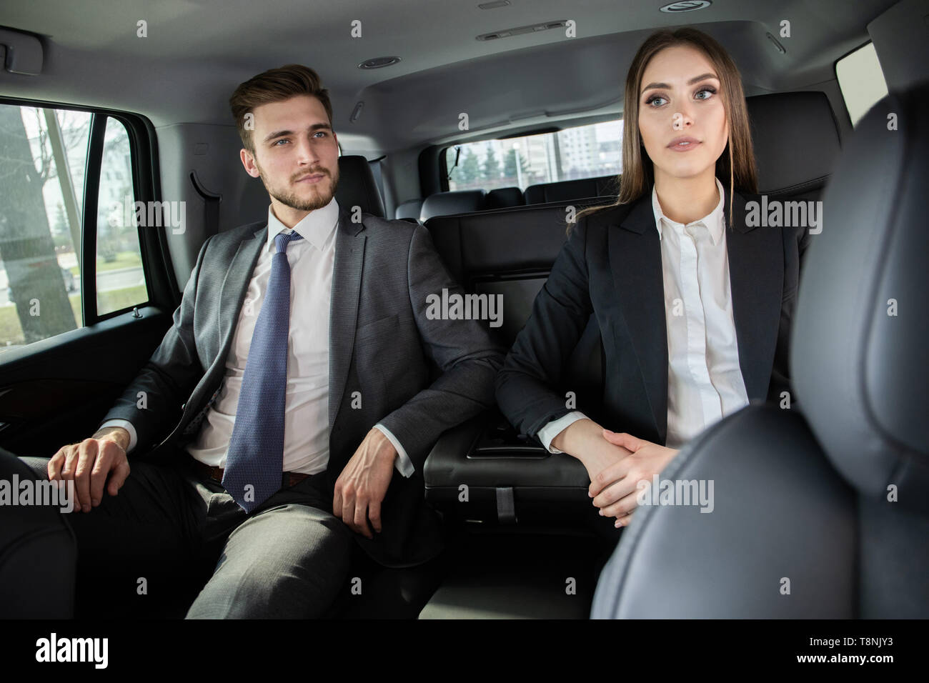 Conversation of two business people in driving car Stock Photo - Alamy