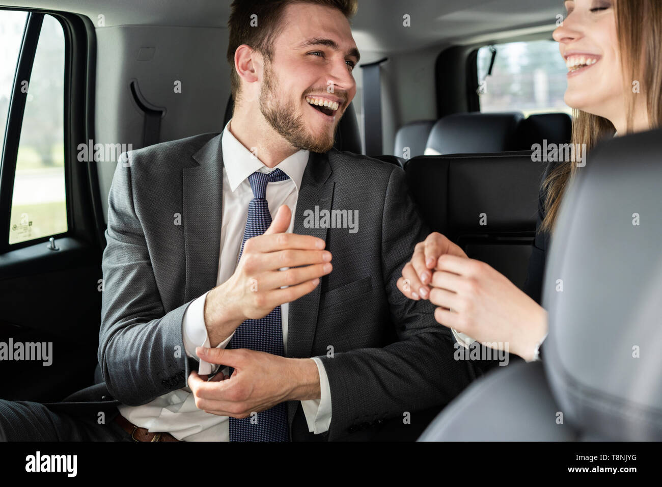Conversation of two business people in driving car Stock Photo - Alamy